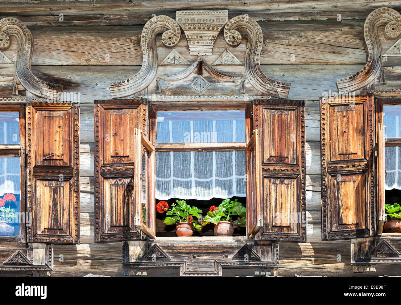 Windows on the facade of the wooden house. Old Russian country style ...