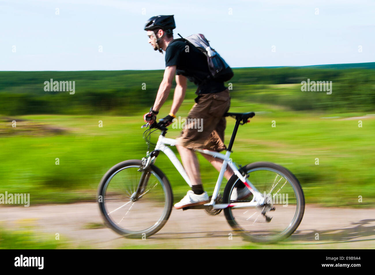 A man riding a mountain bike Stock Photo - Alamy