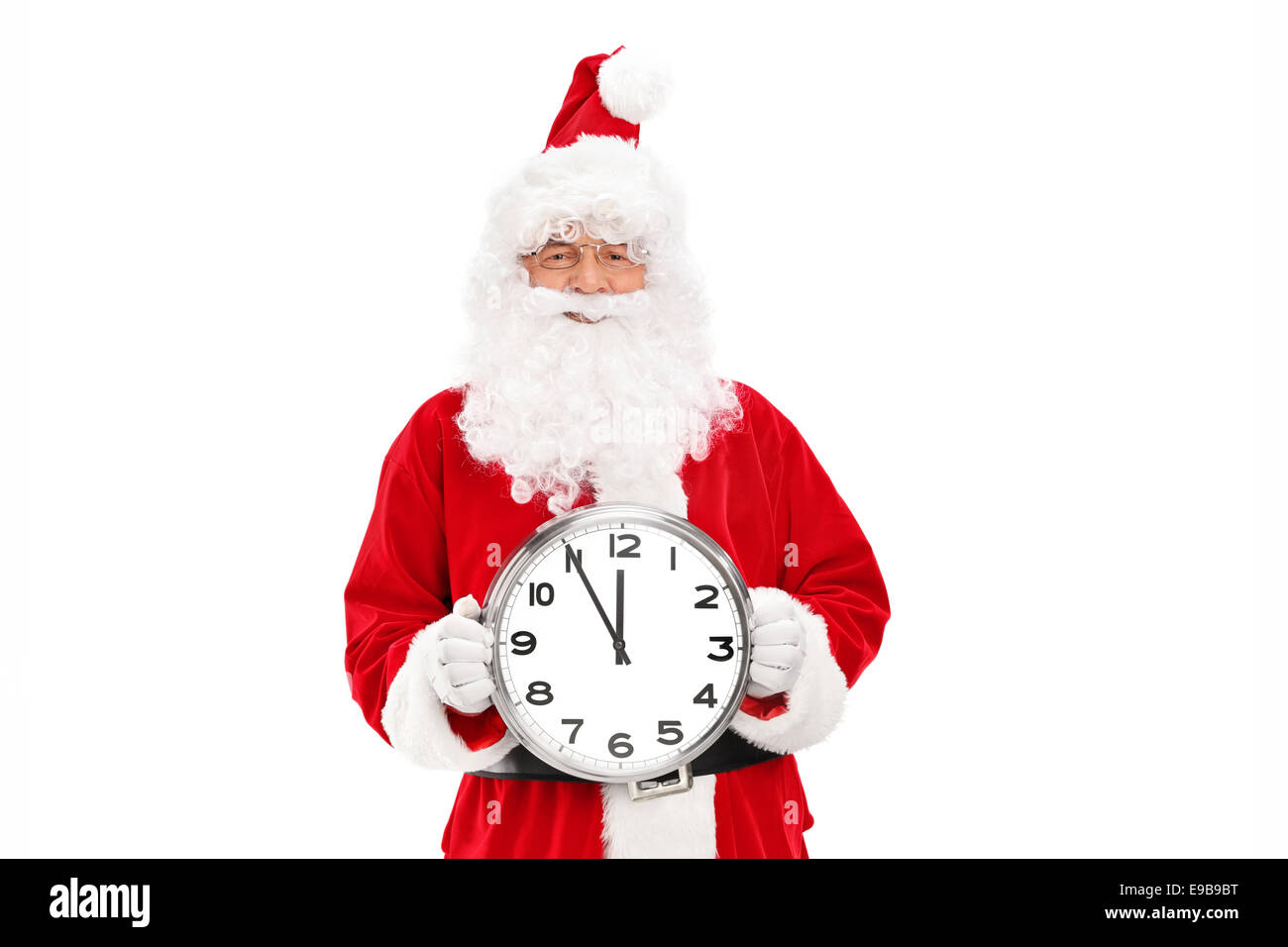 Santa Claus holding a big wall clock isolated on white background Stock ...