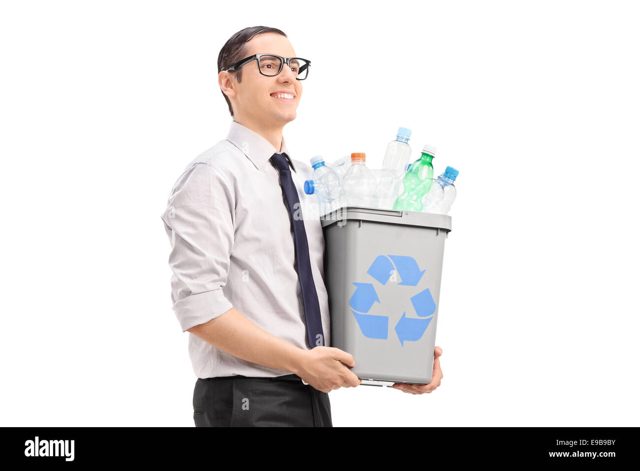 Young man carrying a recycle bin isolated on white background Stock ...