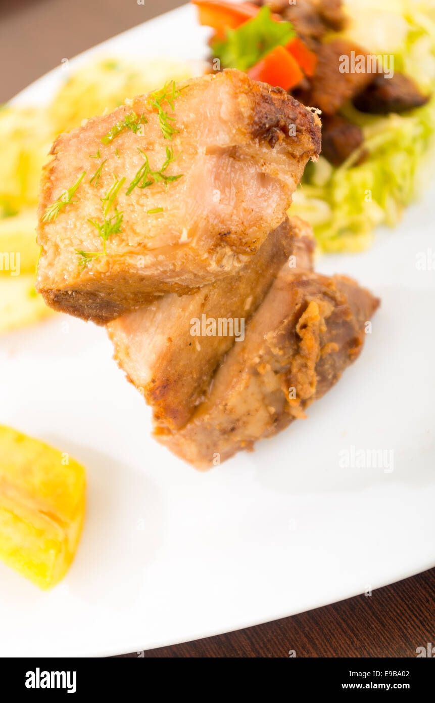 fritada fried pork traditional ecuadorian food Stock Photo - Alamy