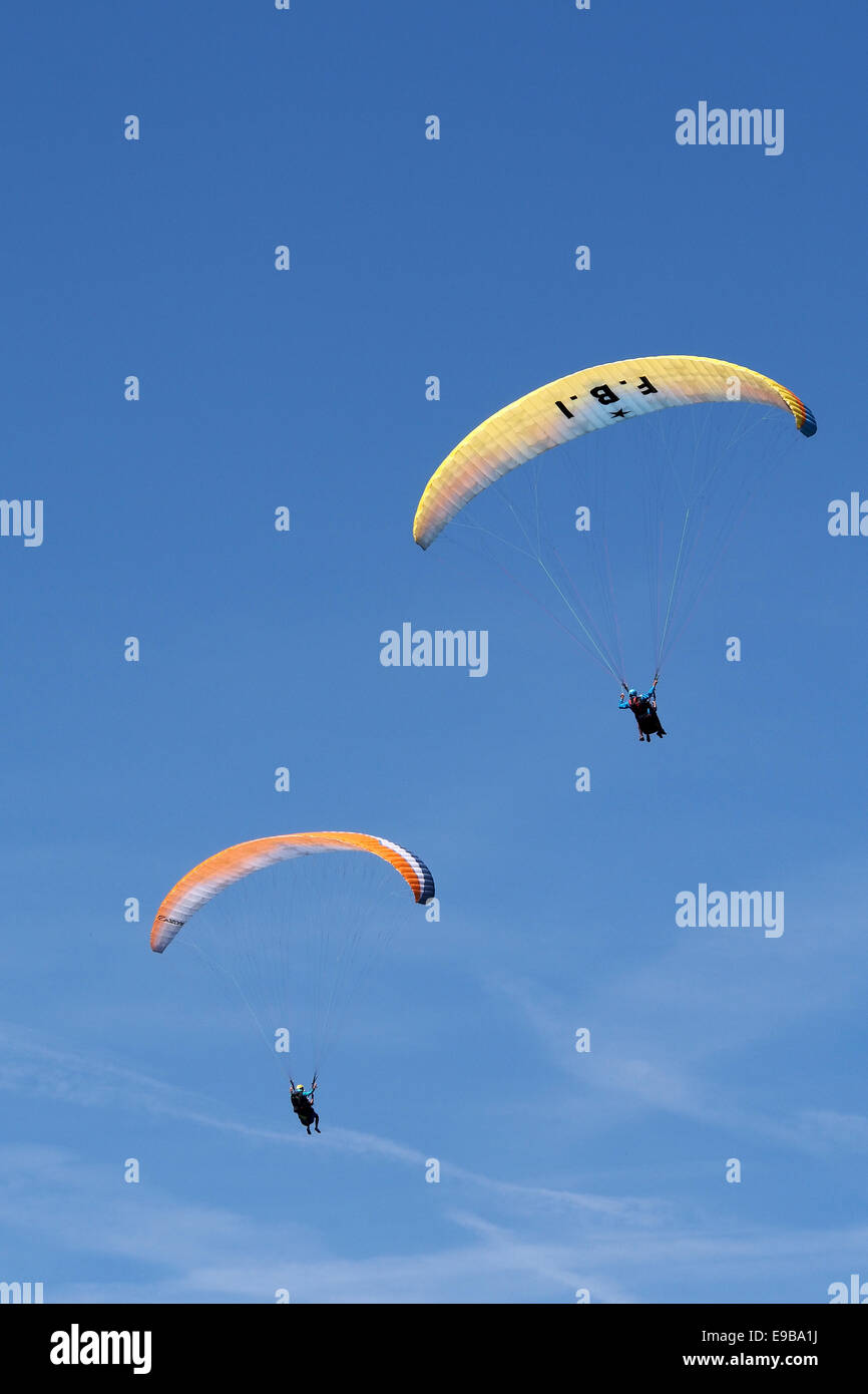 One dual and one single seat paraglider against blue sky Stock Photo ...