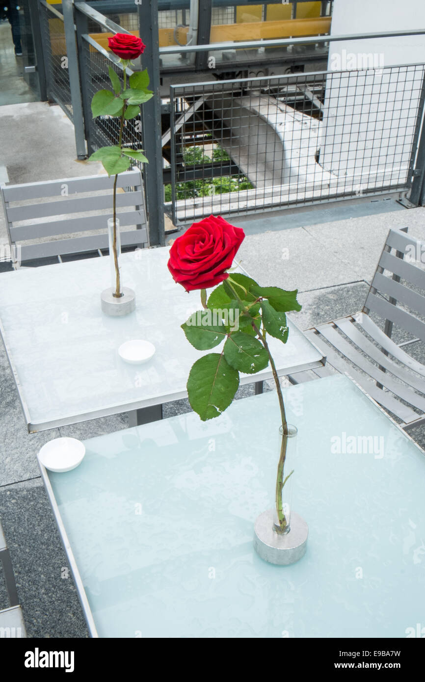 Romantic setting with red roses on tables at this cafe/restaurant on ...