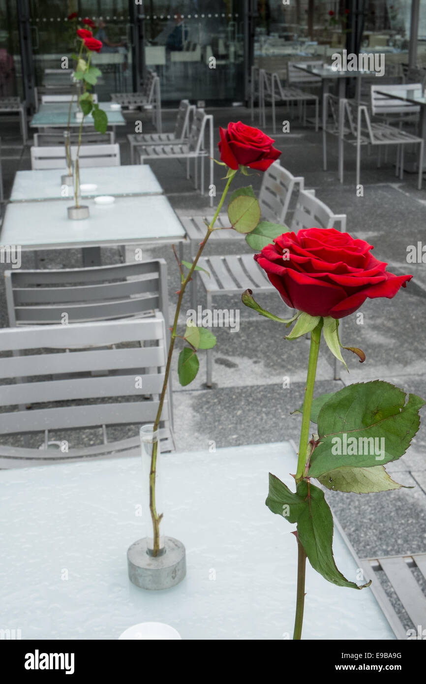 Romantic setting with red roses on tables at this cafe/restaurant on ...