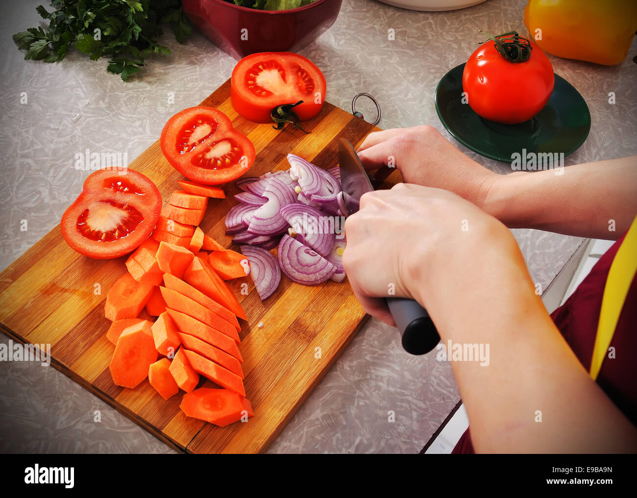 human hands cooking vegetables salad in kitchen Stock Photo - Alamy