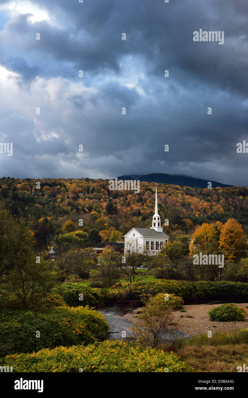 Dark clouds over Stowe Community Church against Fall color on Brush ...