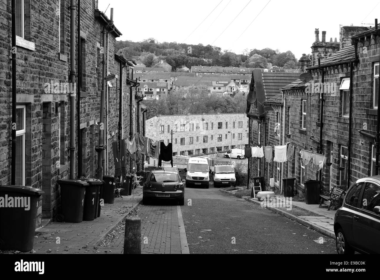Back to back terraced houses with washing strung across the road in ...