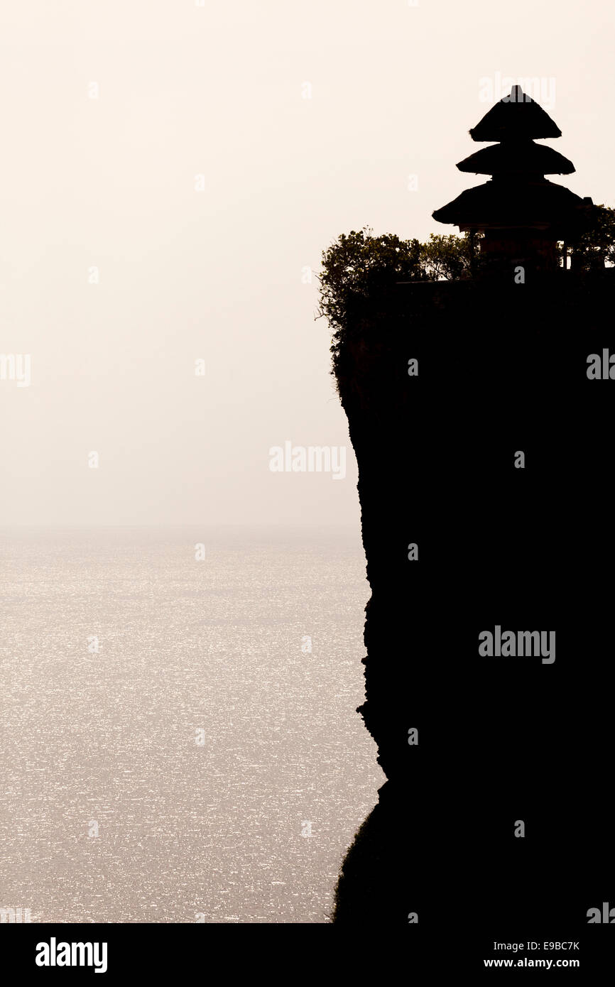 [Uluwatu temple], silhouette of cliff top temple against sea, Bali ...