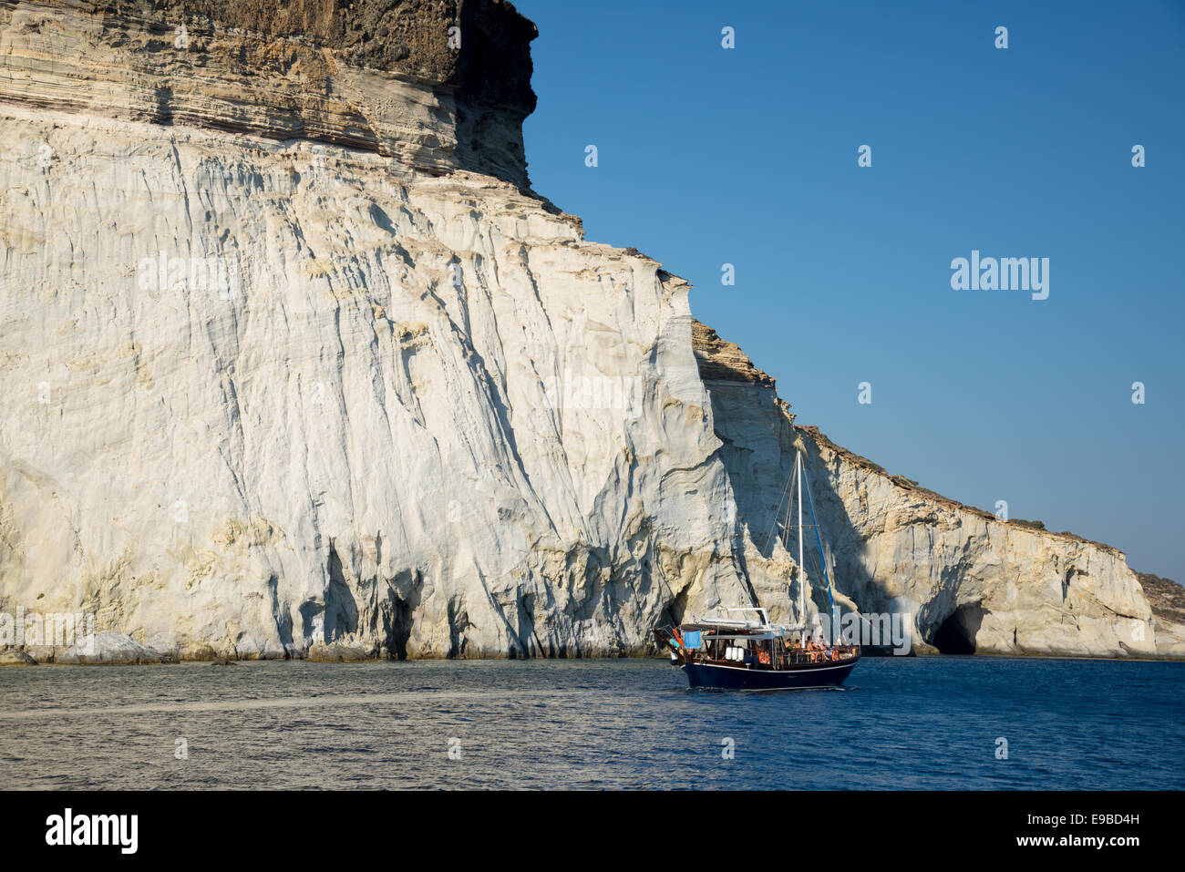 boat alongside the white cliffs of gerontas at milos in greece Stock ...