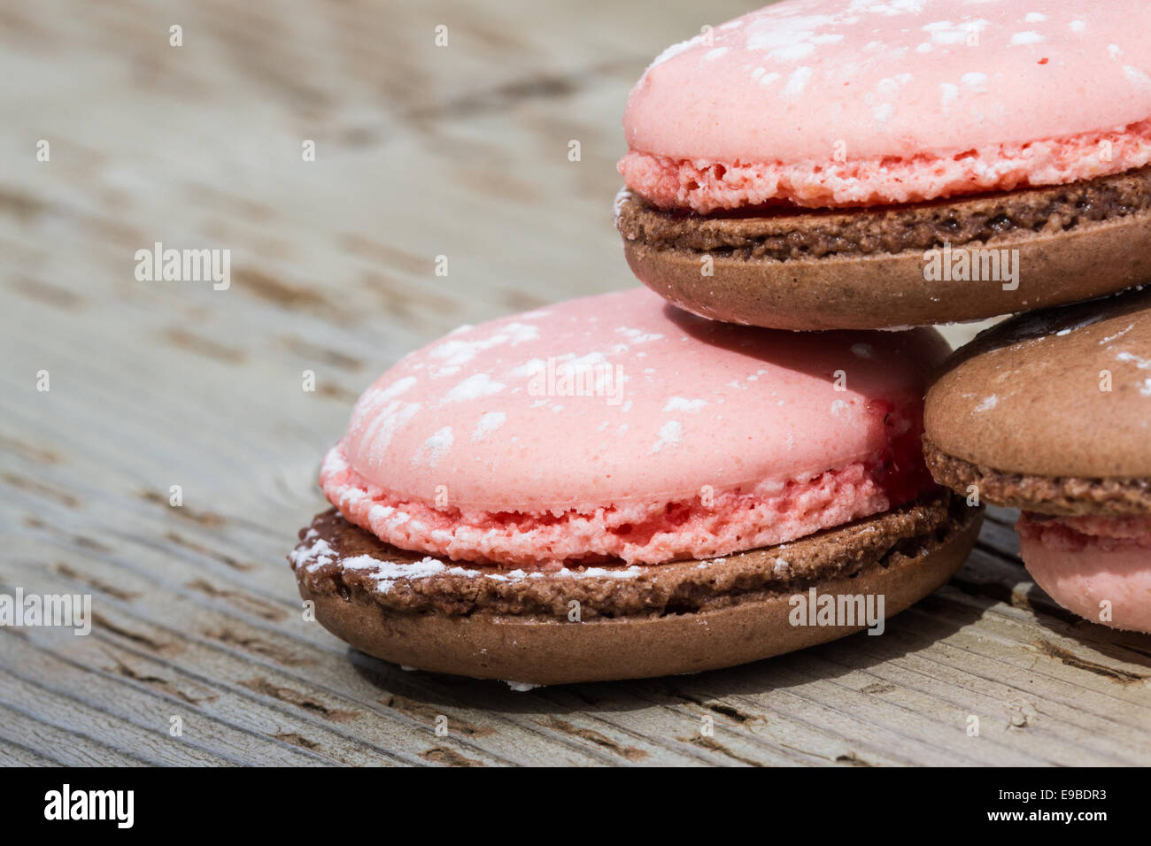 delicious french macaroons served on a rustic wooden table Stock Photo ...