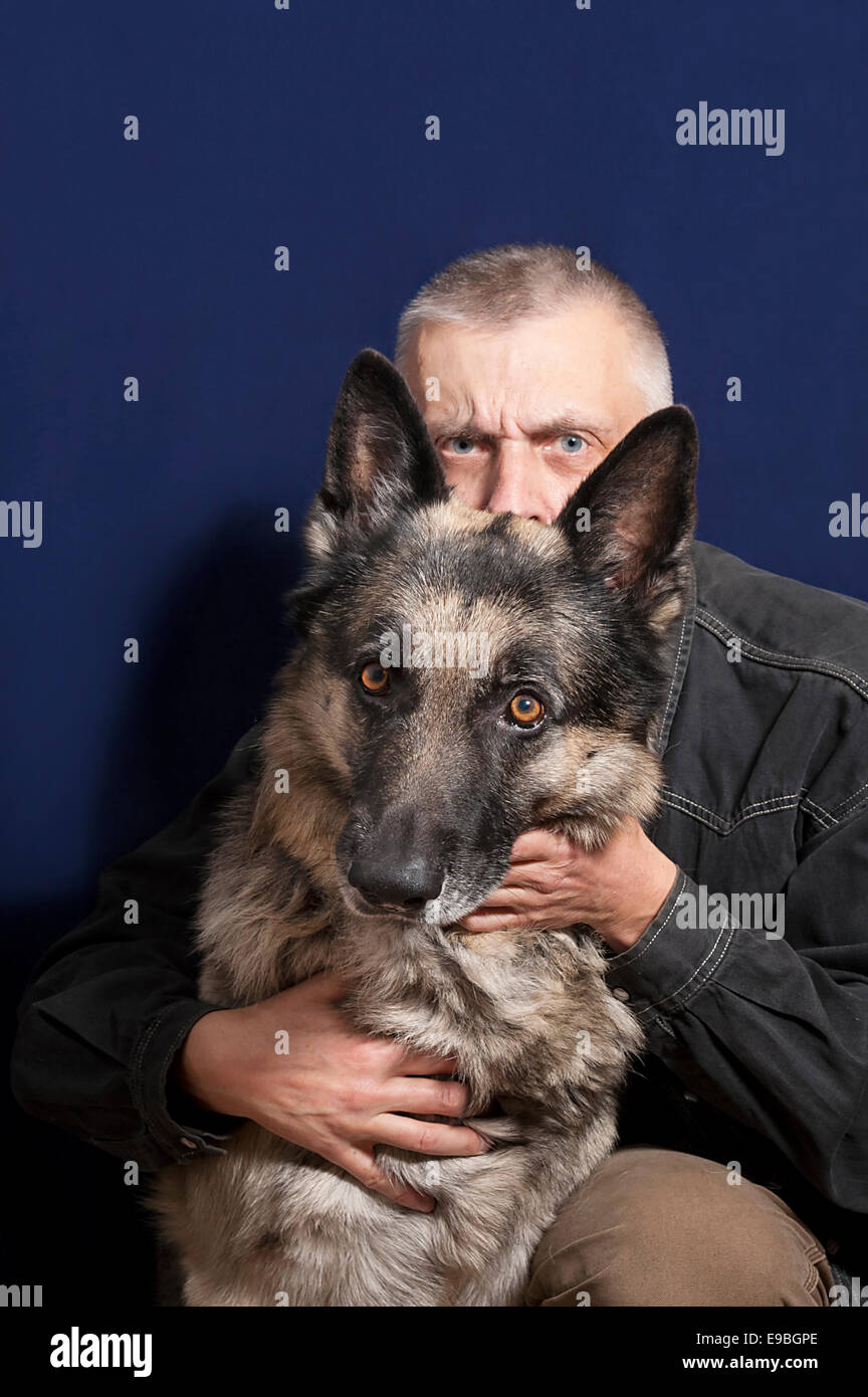 Man with his shepherd dog Stock Photo - Alamy