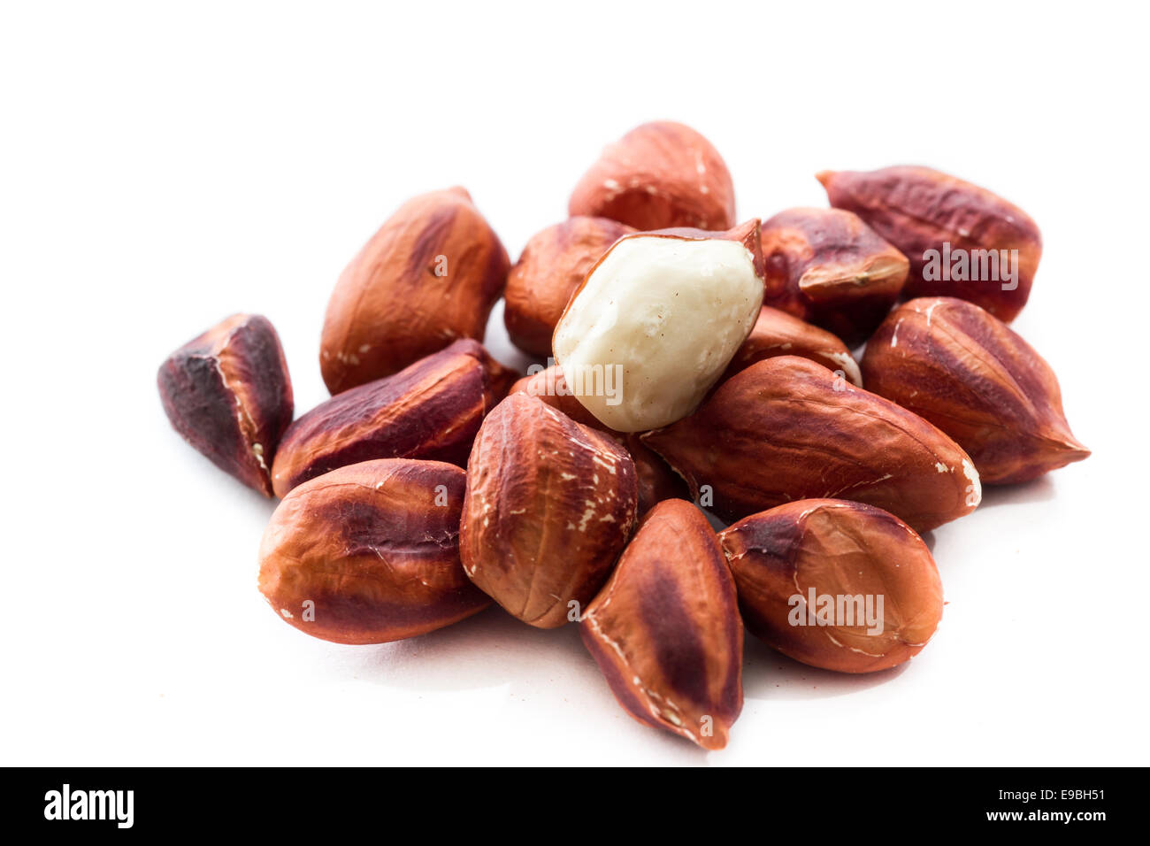 close up of organic raw jungle peanuts isolated on a white background ...