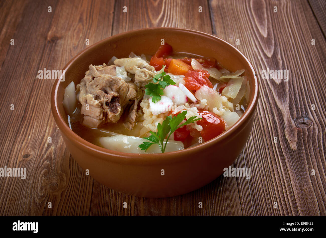 chicken posole garnished with carrots, tomato and radish Stock Photo ...