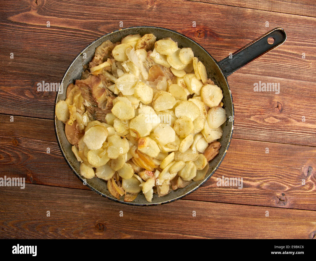 Baked red grouper with potato and apple Stock Photo - Alamy