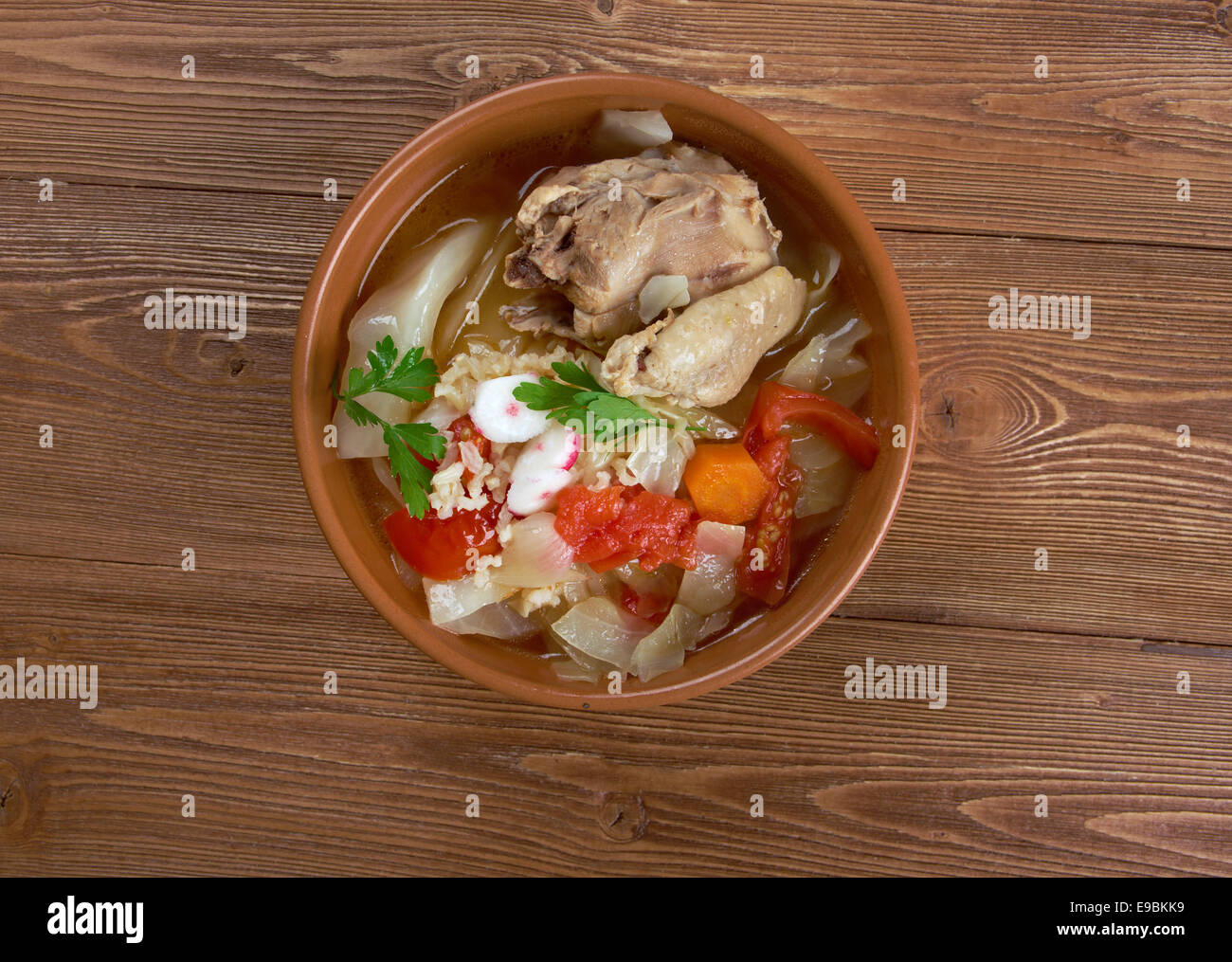 chicken posole garnished with carrots, tomato and radish Stock Photo ...