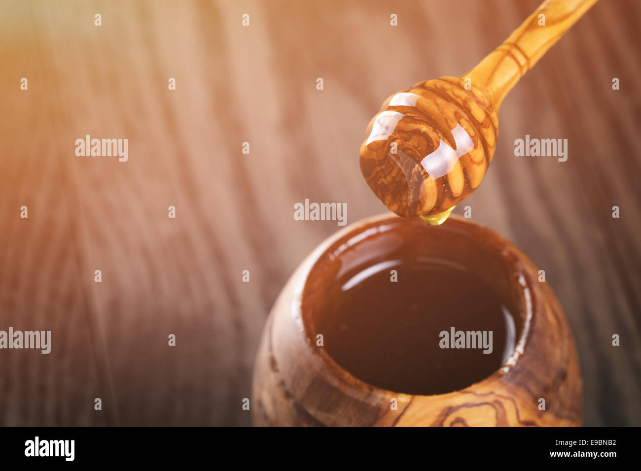 maple honey flowing from dipper to pot, rustic style Stock Photo - Alamy