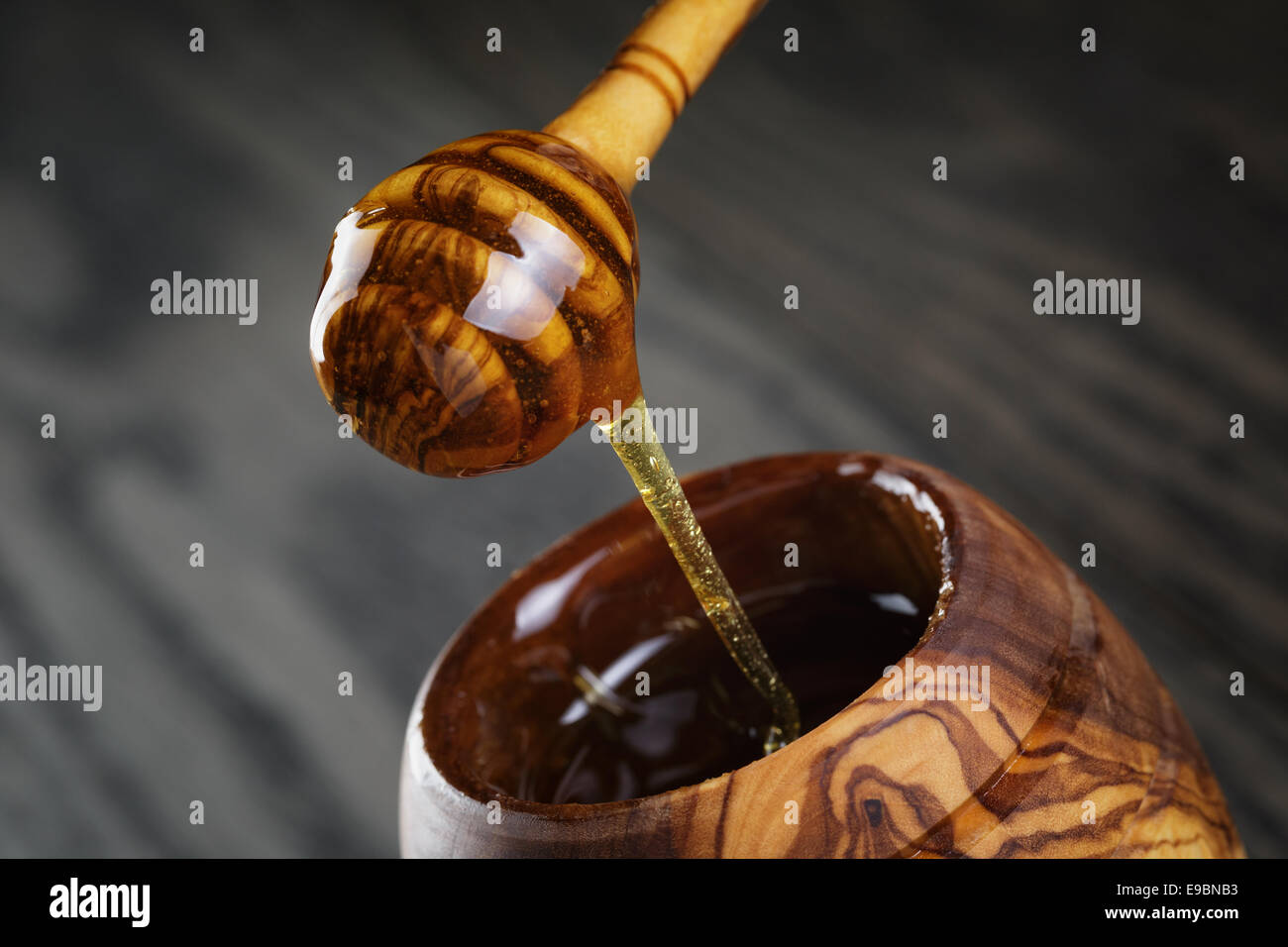 maple honey flowing from dipper to pot, rustic style Stock Photo - Alamy