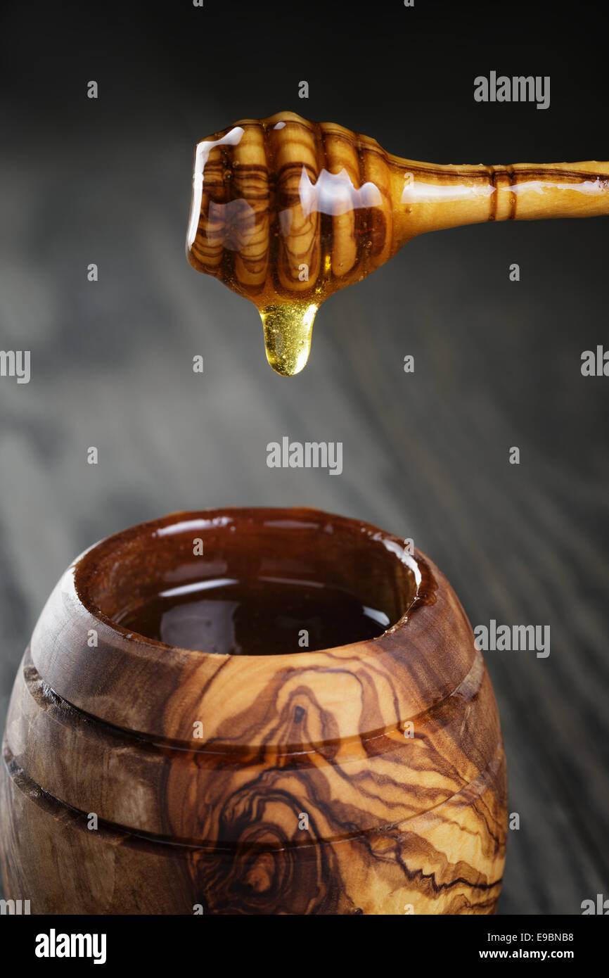 maple honey drop from dipper to pot, rustic style Stock Photo - Alamy