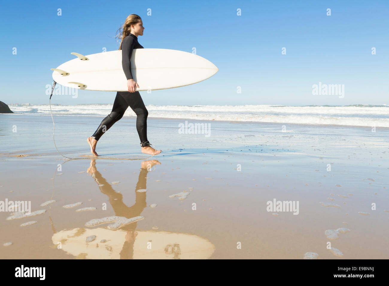 Run into ocean beach wetsuit hi-res stock photography and images - Alamy