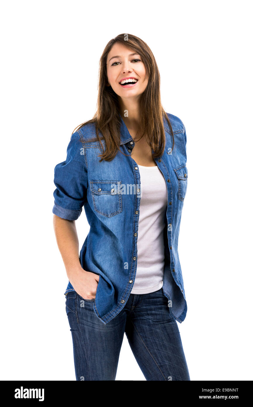 Beautiful woman standing over a white background with hands on the ...