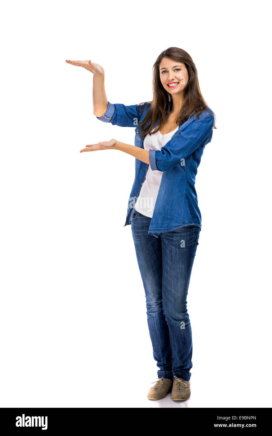 Beautiful woman showing something over a white background Stock Photo ...