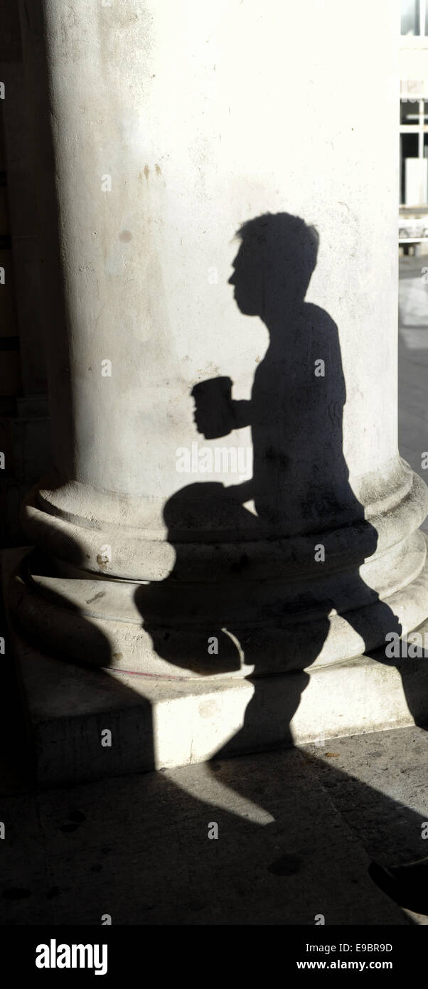 Shadow figures of man carrying a drink Stock Photo - Alamy
