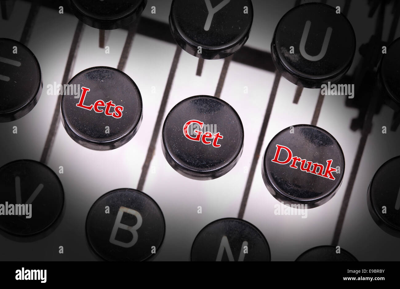 Typewriter with special buttons, lets - get - drunk Stock Photo - Alamy
