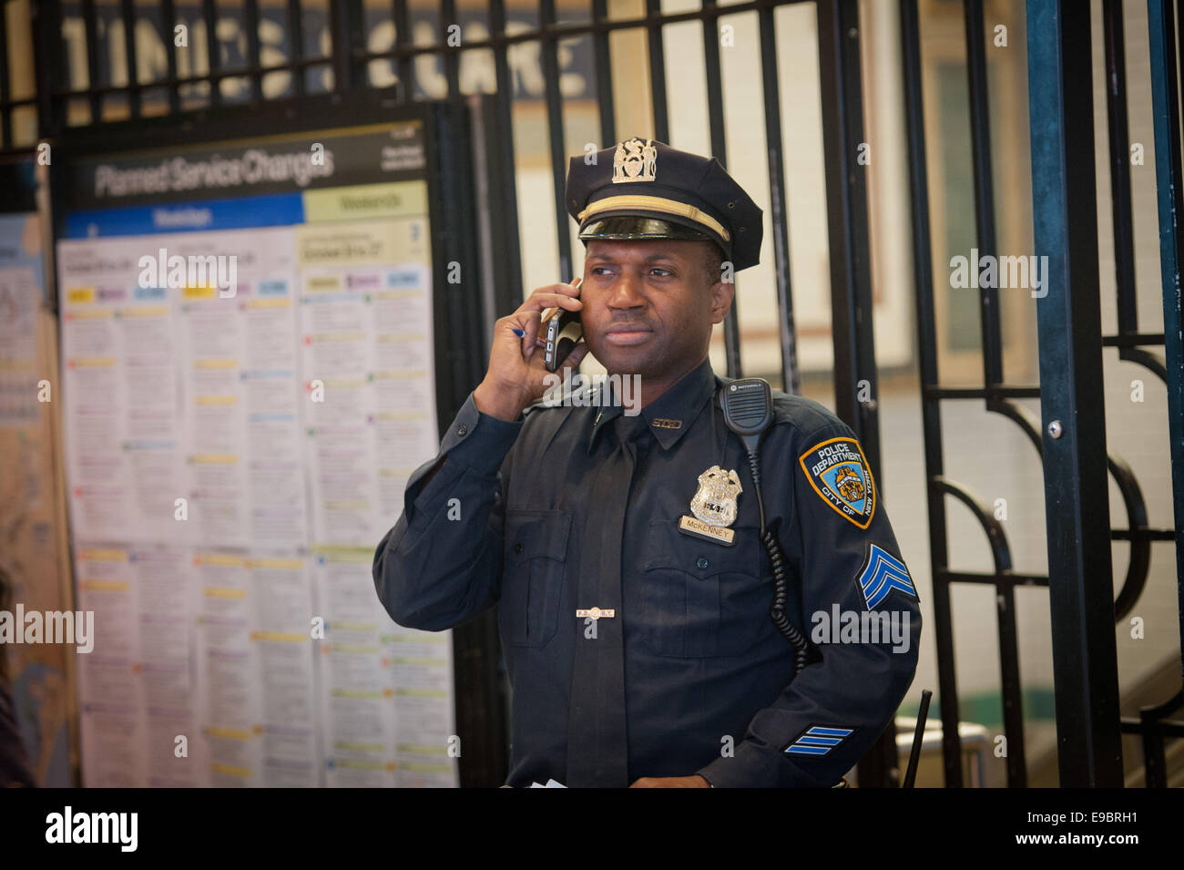 Manhattan, New York, USA. 23rd Oct, 2014. An officer on the phone in ...