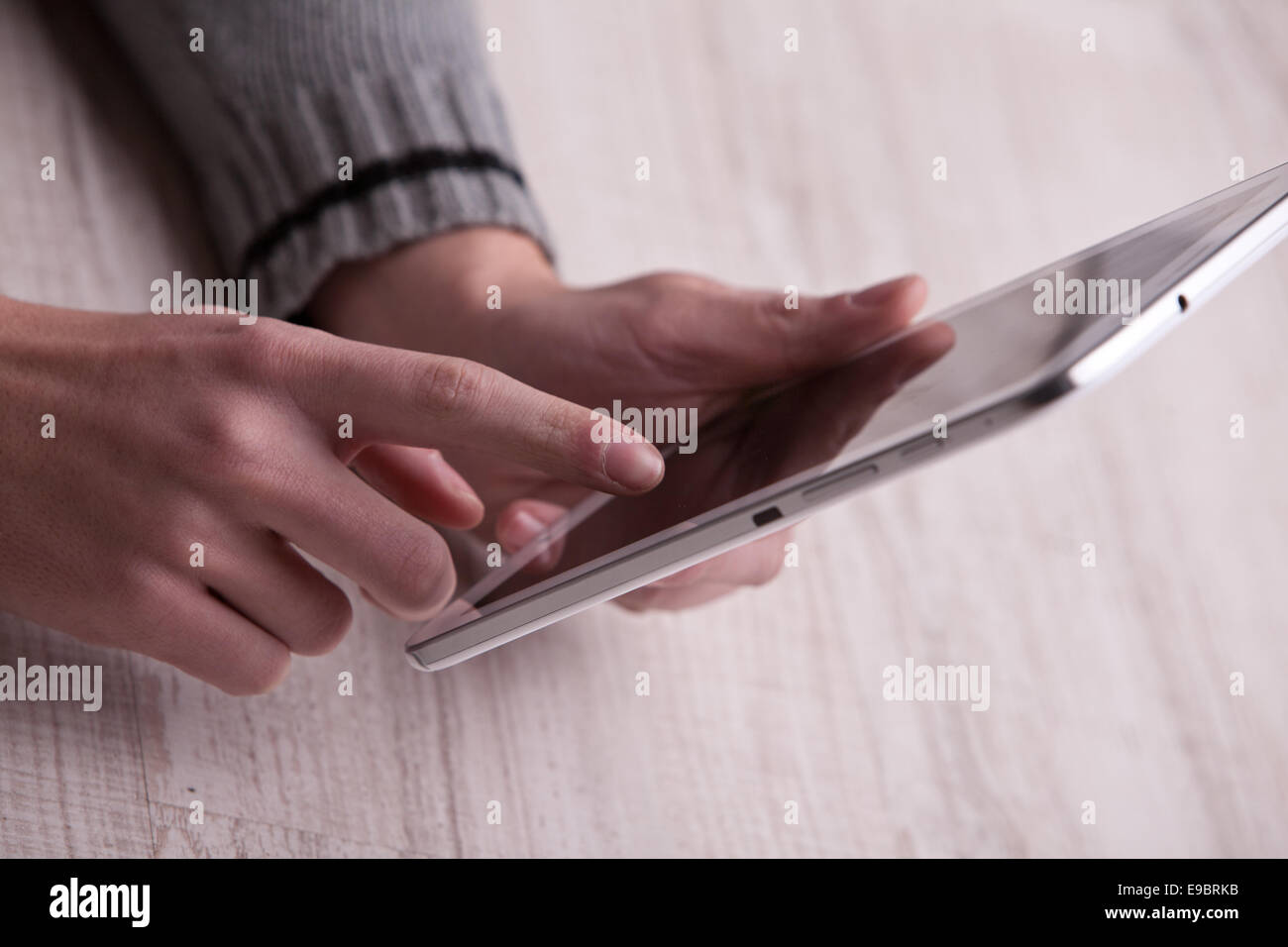 a hand of a young man touching a tablet Stock Photo - Alamy