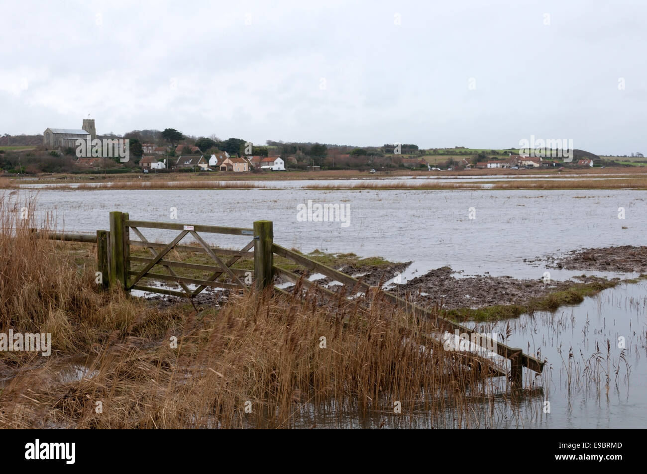 Salthouse village seen across flooded marsh in winter Stock Photo - Alamy
