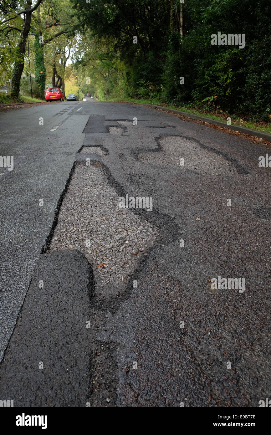 Dangerous deep large Potholes on road Stock Photo - Alamy