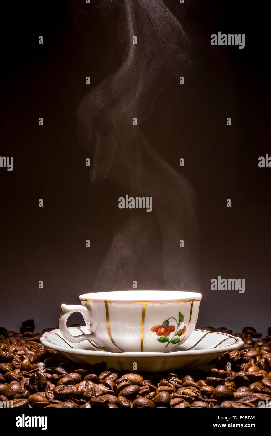 cup of warm coffee with coffee beans Stock Photo - Alamy
