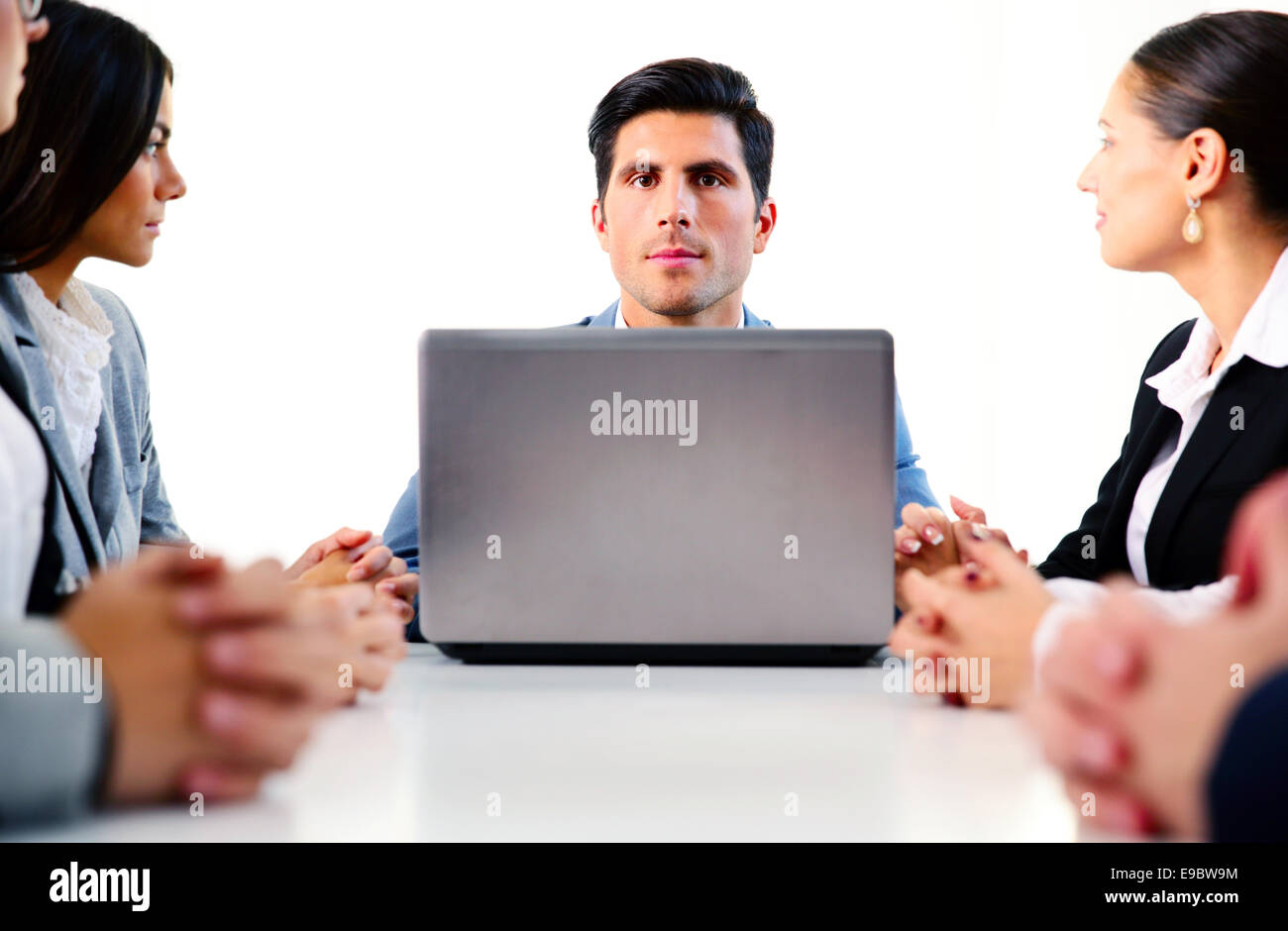 Business meeting - manager discussing work with his colleagues Stock ...