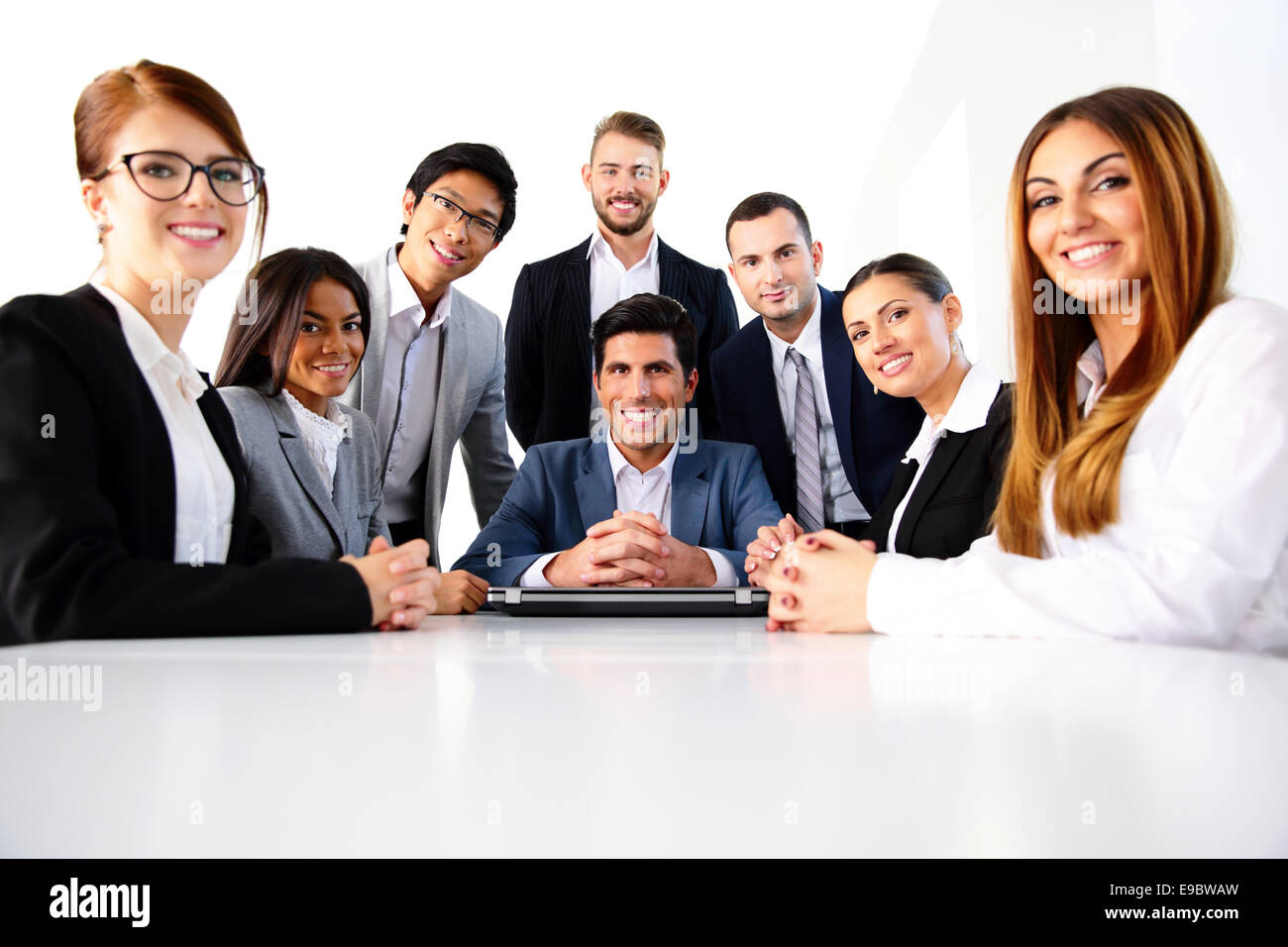 Group of a smiling colleagues in office Stock Photo - Alamy