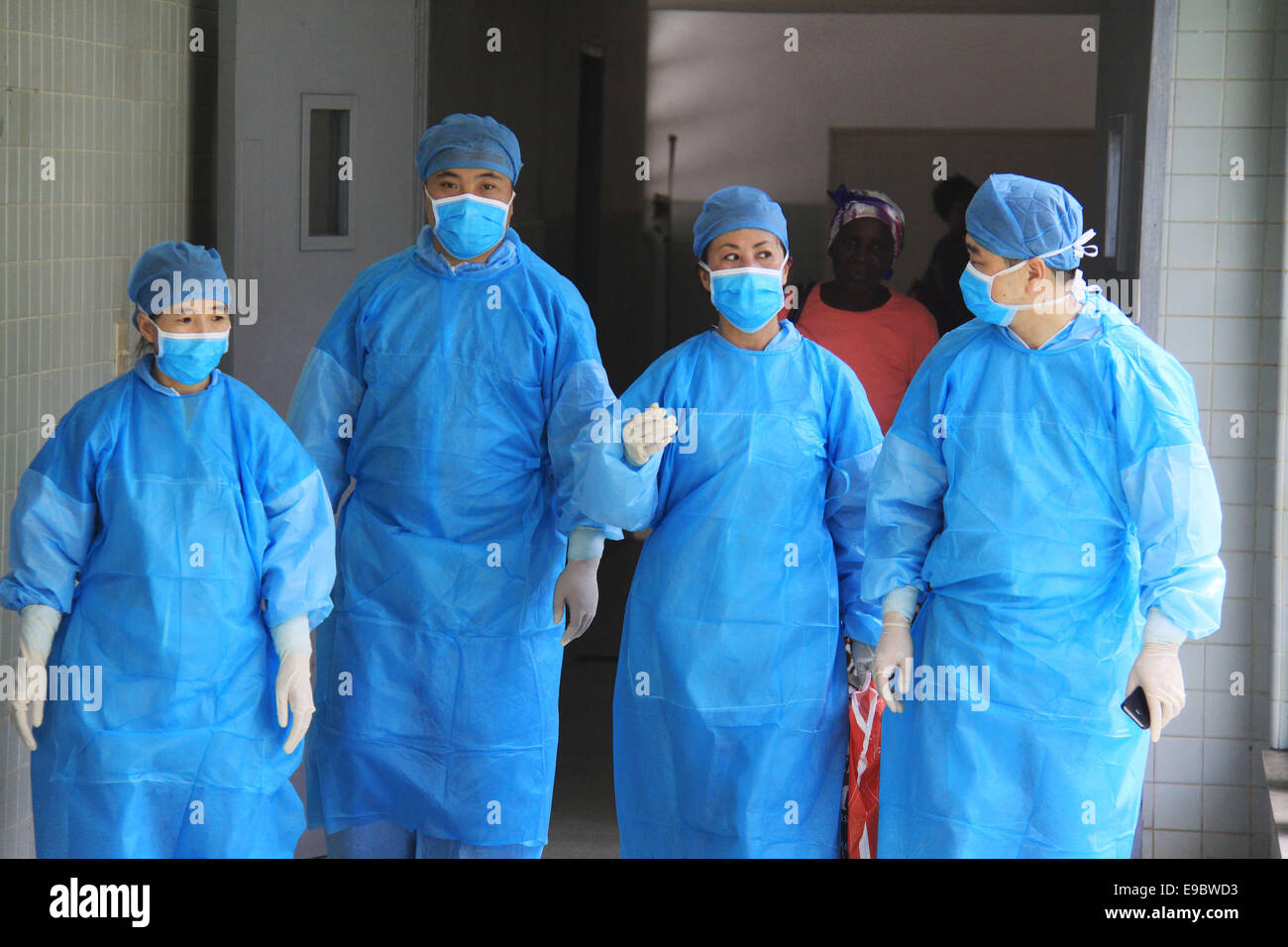 Monrovia. 23rd Oct, 2014. Chinese medical experts walk in a hospital in ...