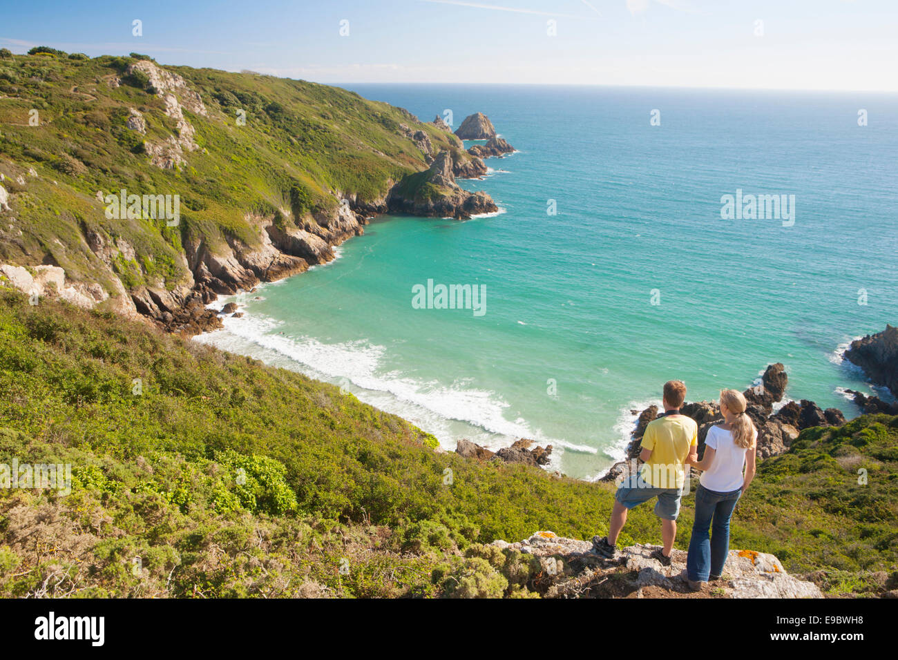 PETIT PORT BAY AND COUPLE Stock Photo - Alamy