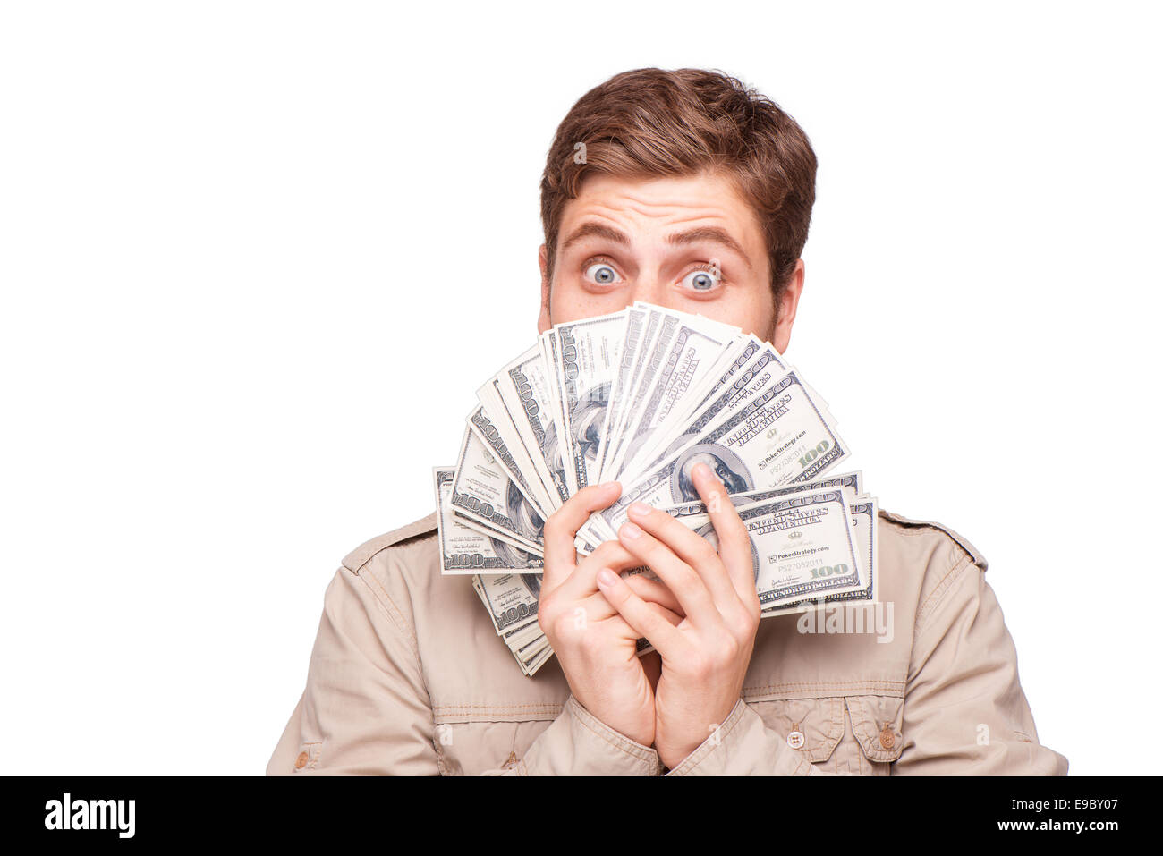 Excited young man with soft money Stock Photo - Alamy