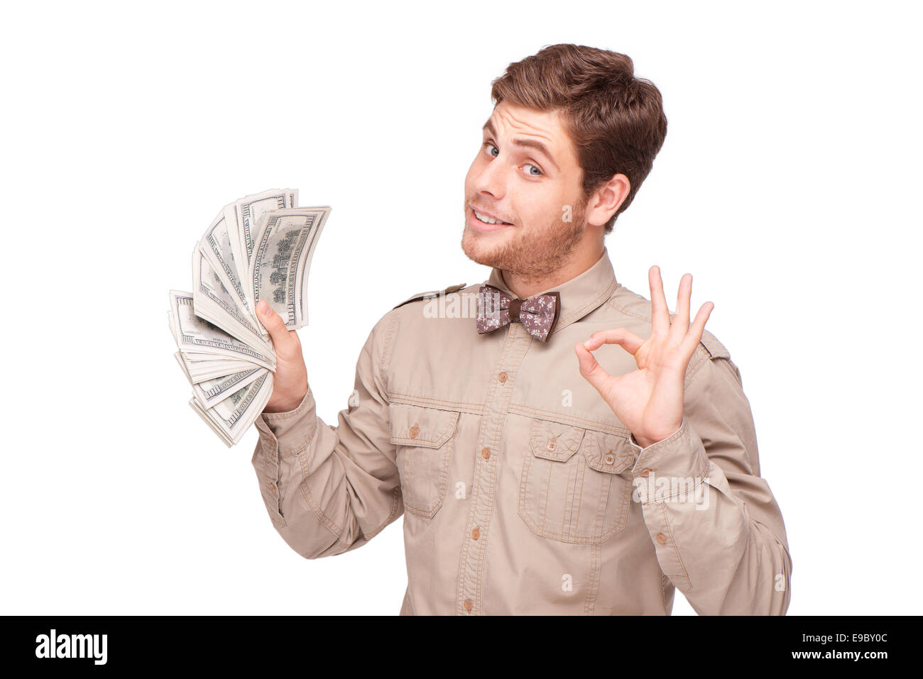 Happy young man with soft money Stock Photo - Alamy