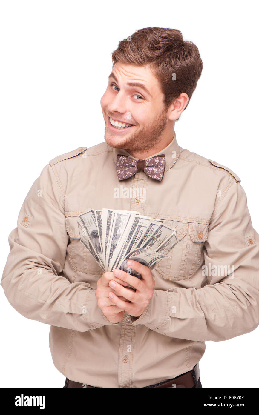 Cheerful young man with soft money Stock Photo - Alamy