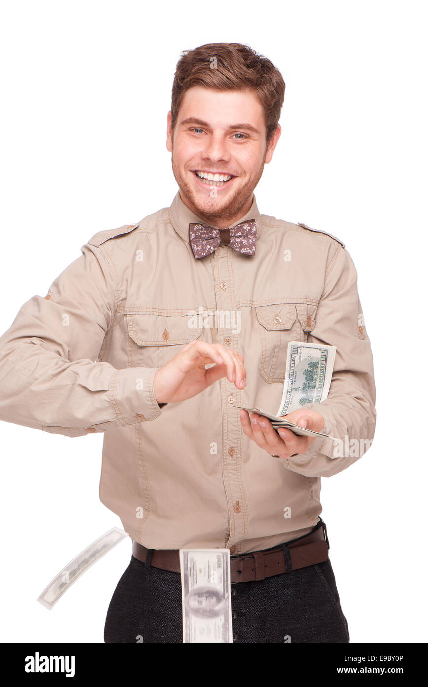 Cheerful young man with soft money Stock Photo - Alamy