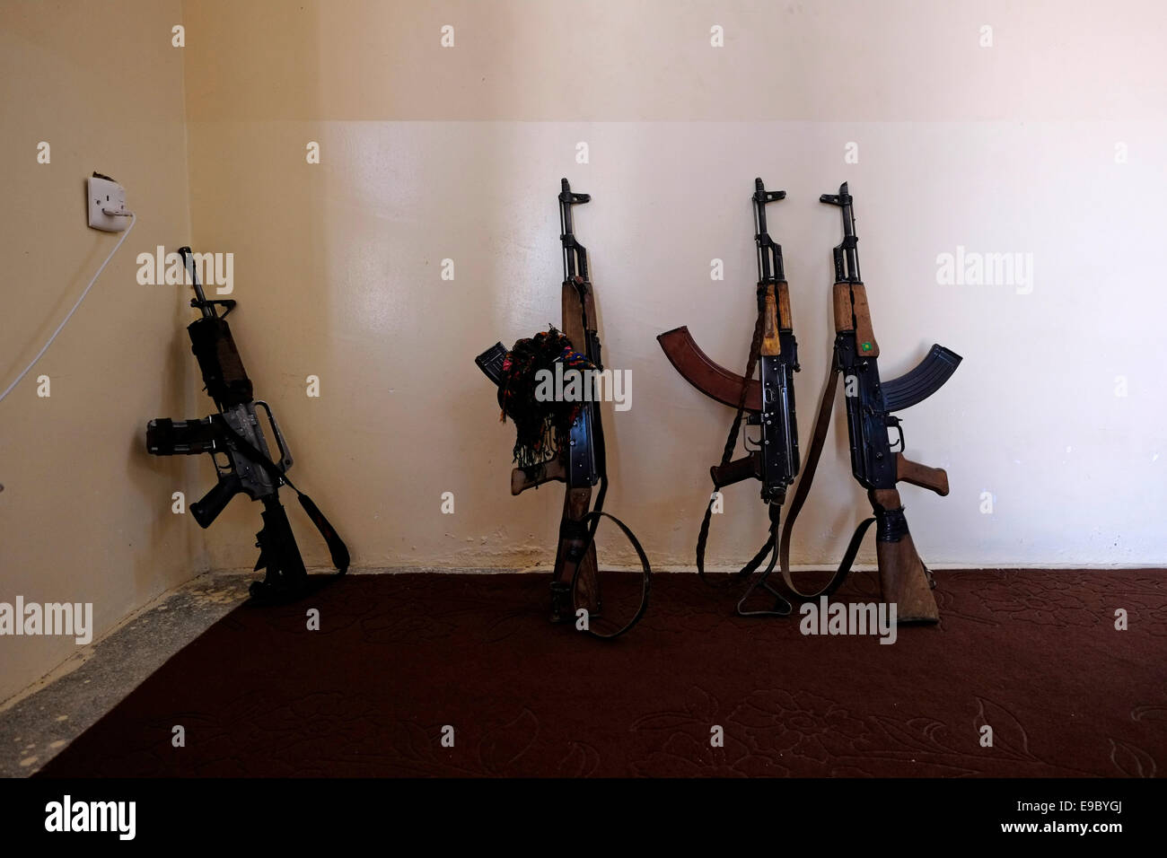 Kalashnikov ak-47 and M-16 guns in a front line outpost of the People's ...