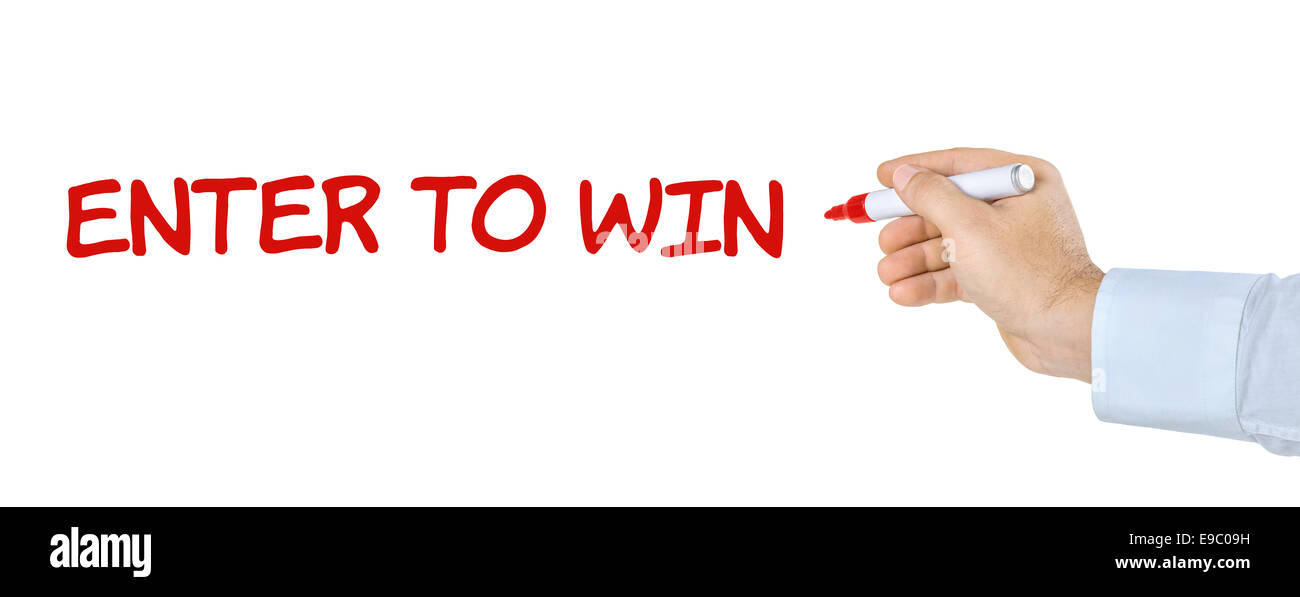 Hand with pen writing Enter to win Stock Photo - Alamy