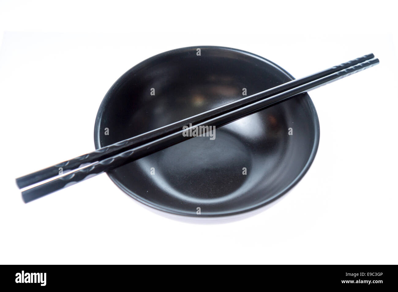 Chinese or Japanese chopsticks on empty black bowl Stock Photo - Alamy