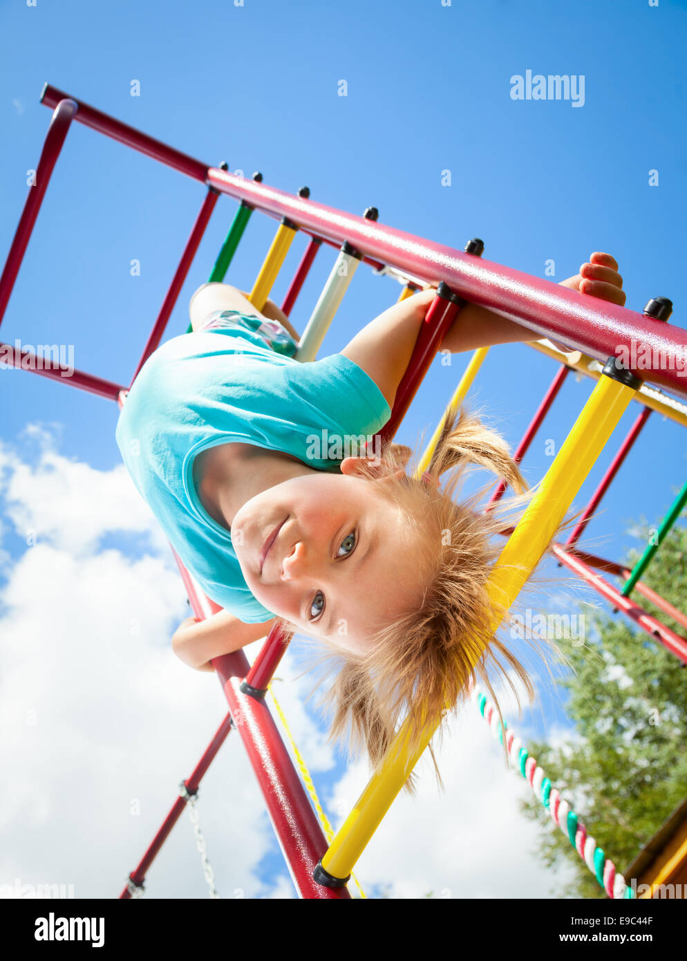 Girl on playground monkey bars hi-res stock photography and images - Alamy