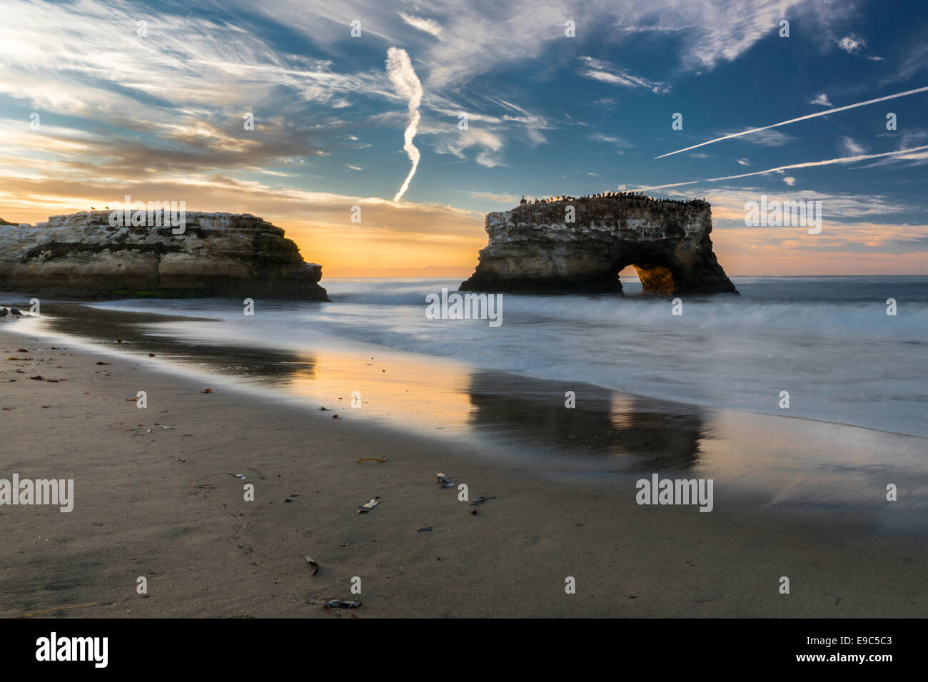 The bridge at Natural Bridges State Beach at Sunrise Stock Photo - Alamy