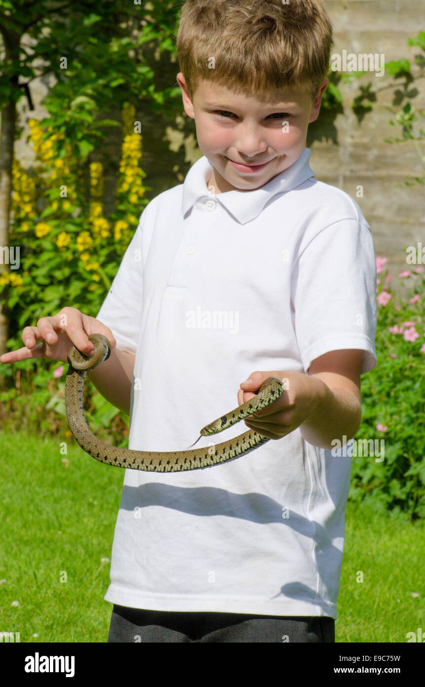 Boy with snake hi-res stock photography and images - Alamy