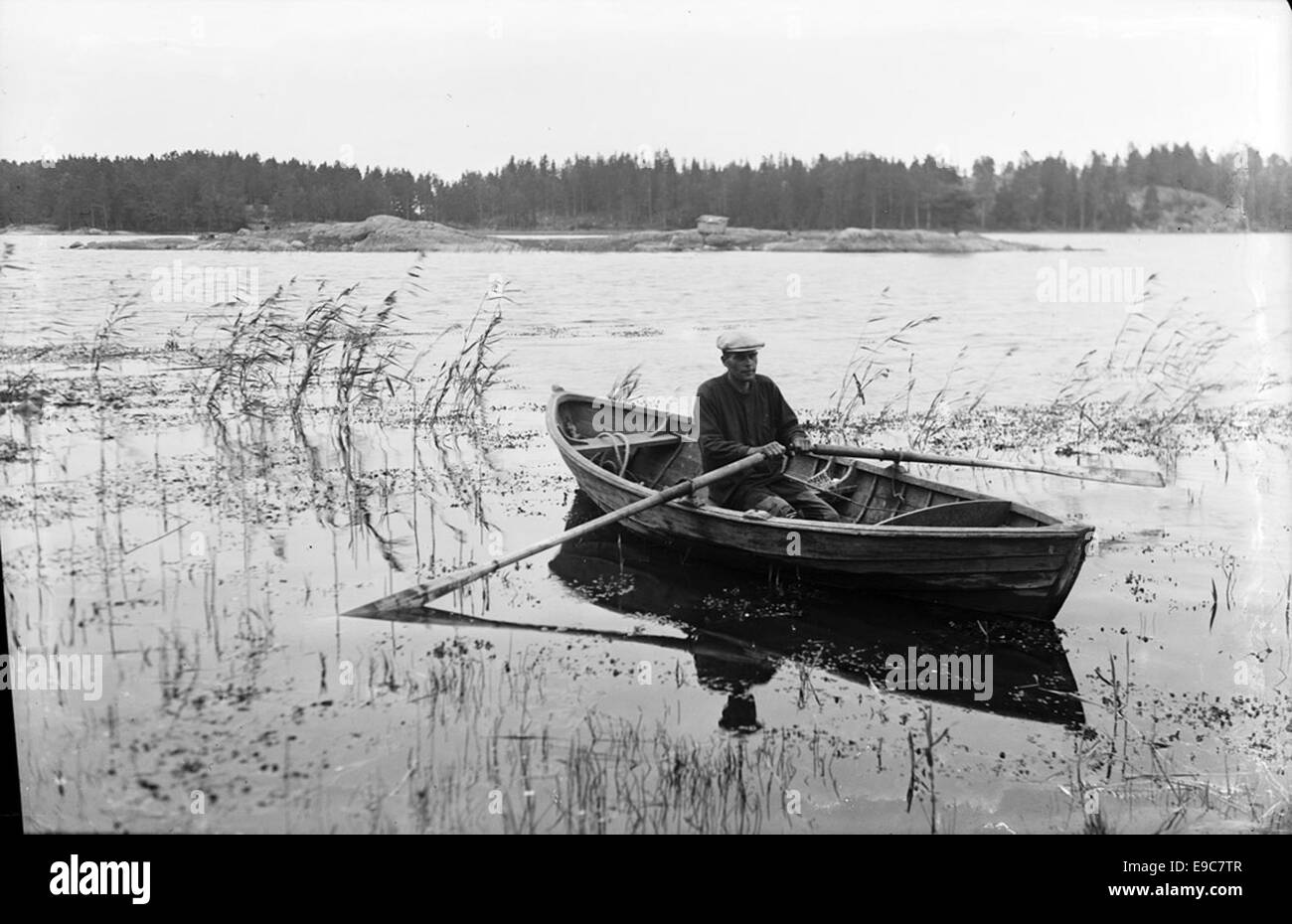A historical photograph of traditional Finnish wooden boats known as ...