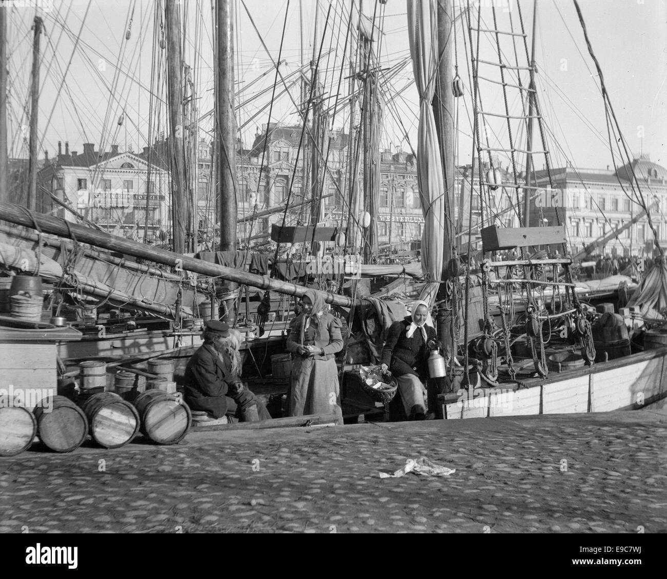 This image shows ships docked at the harbor near the market square in ...