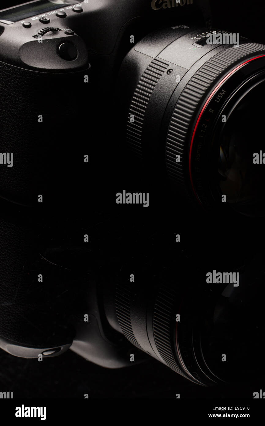 Professional modern DSLR camera low key image - Modern DSLR camera with ...