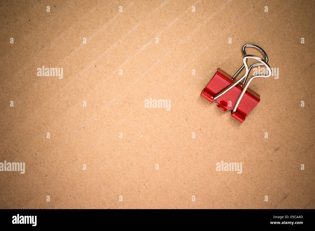 colored metal paper clips on a paperboard surface Stock Photo - Alamy